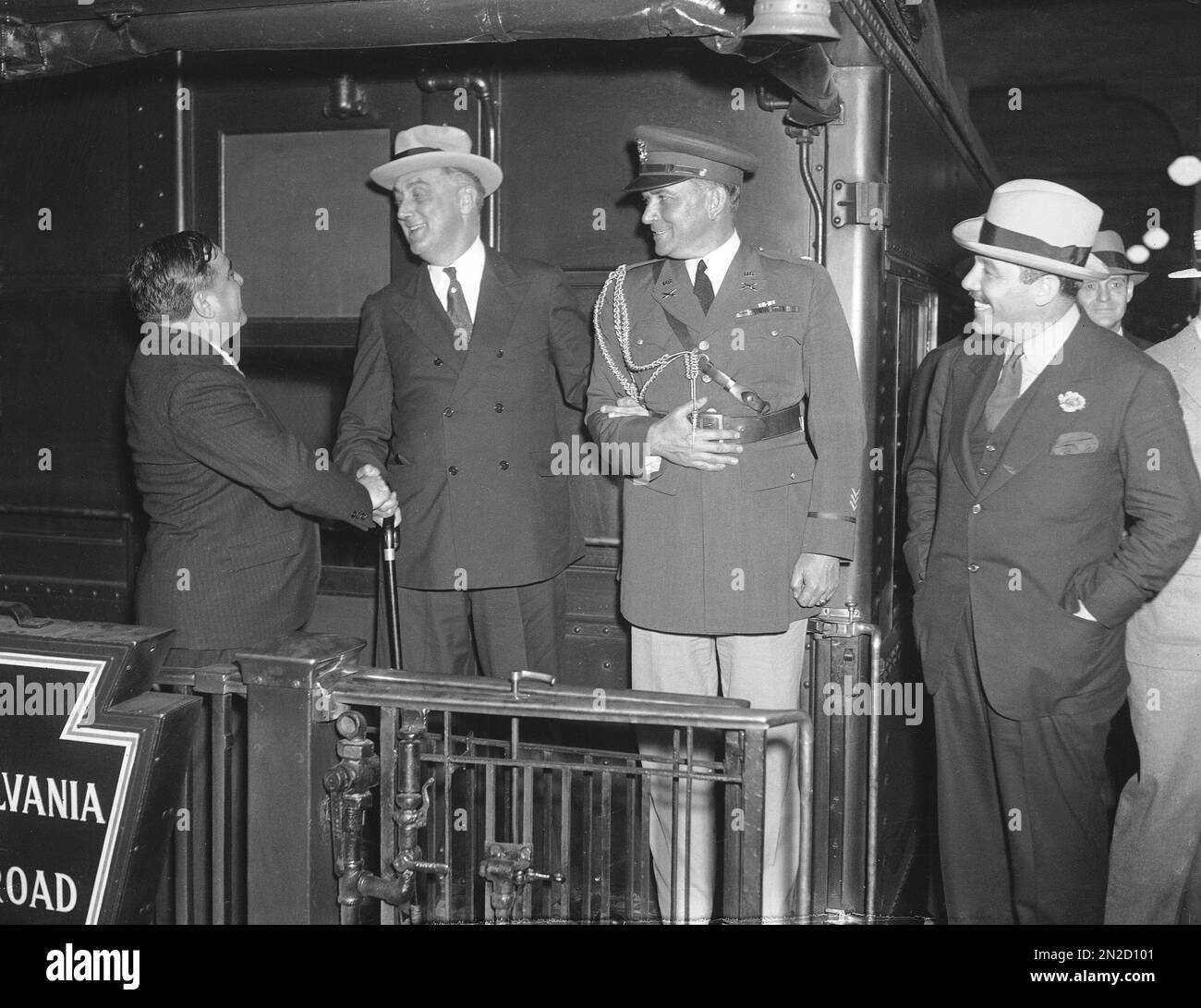 President Franklin D. Roosevelt, leaning on the arm of Col. E.M. Watson ...