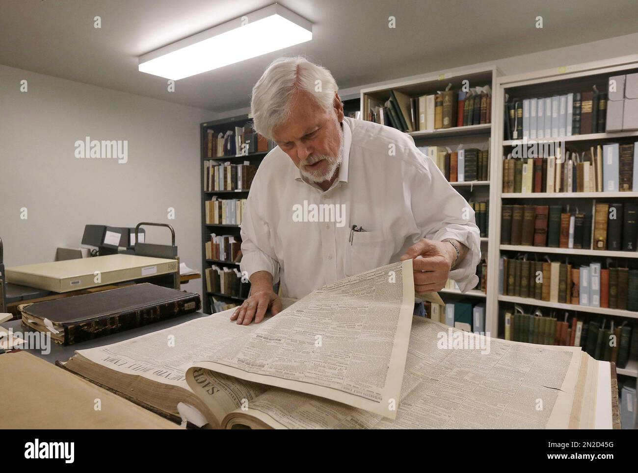 Bob Hirst, general editor of the Mark Twain Project, looks through a ...