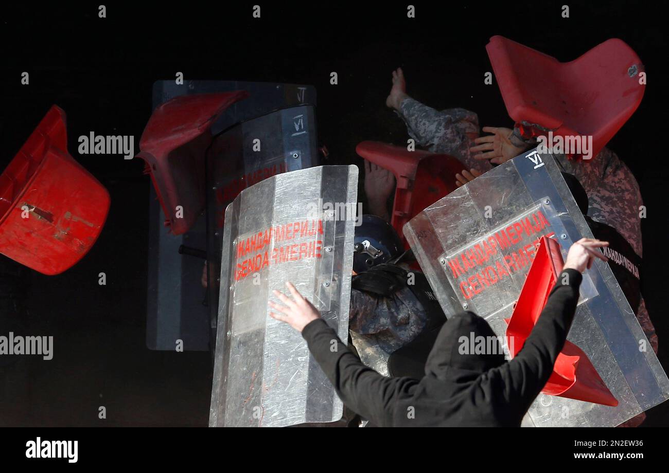 Serbian riot police officers clash with Red Star soccer fans during a ...