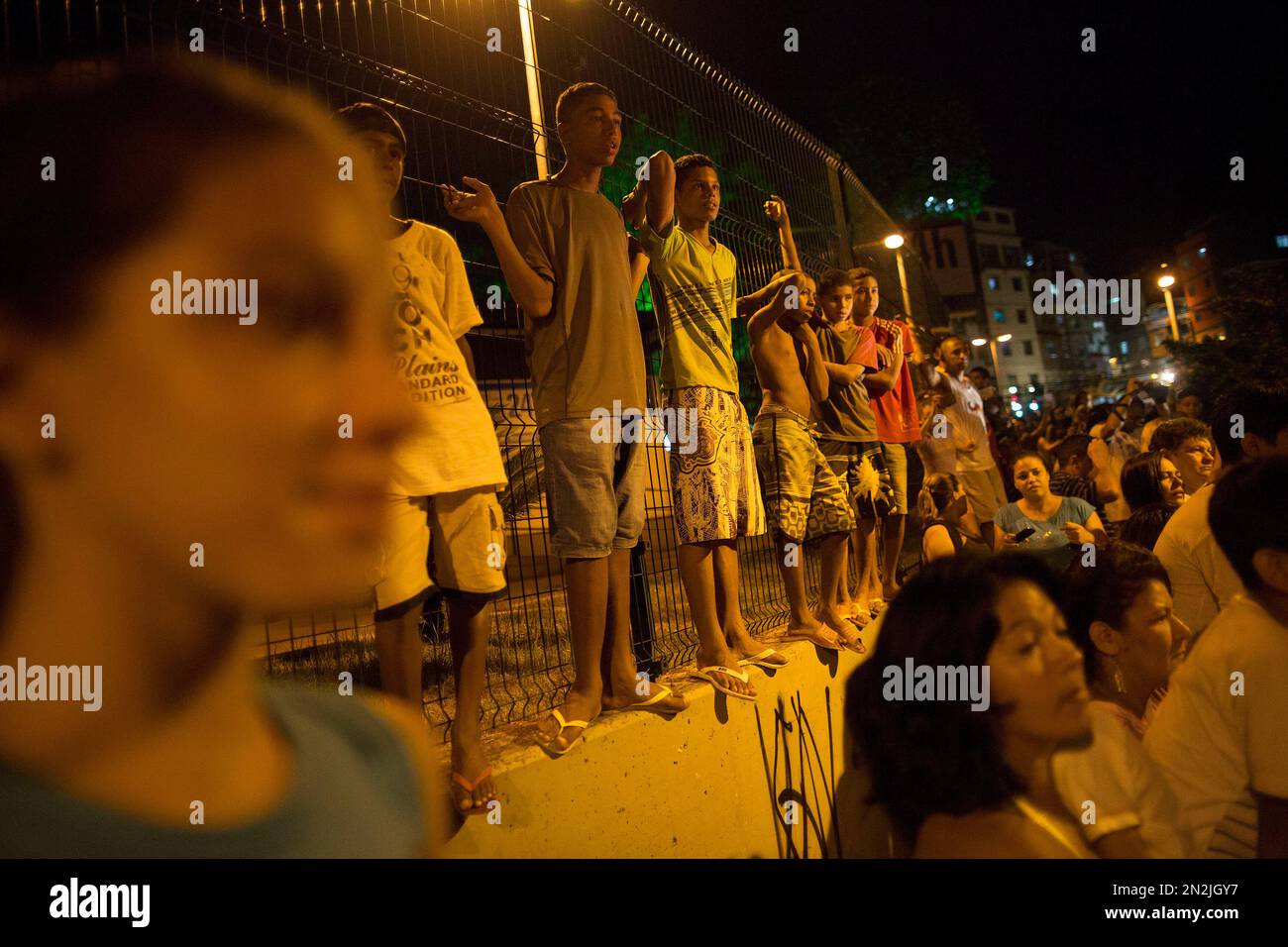 Residents watch the Passion of Christ procession on Good Friday during ...