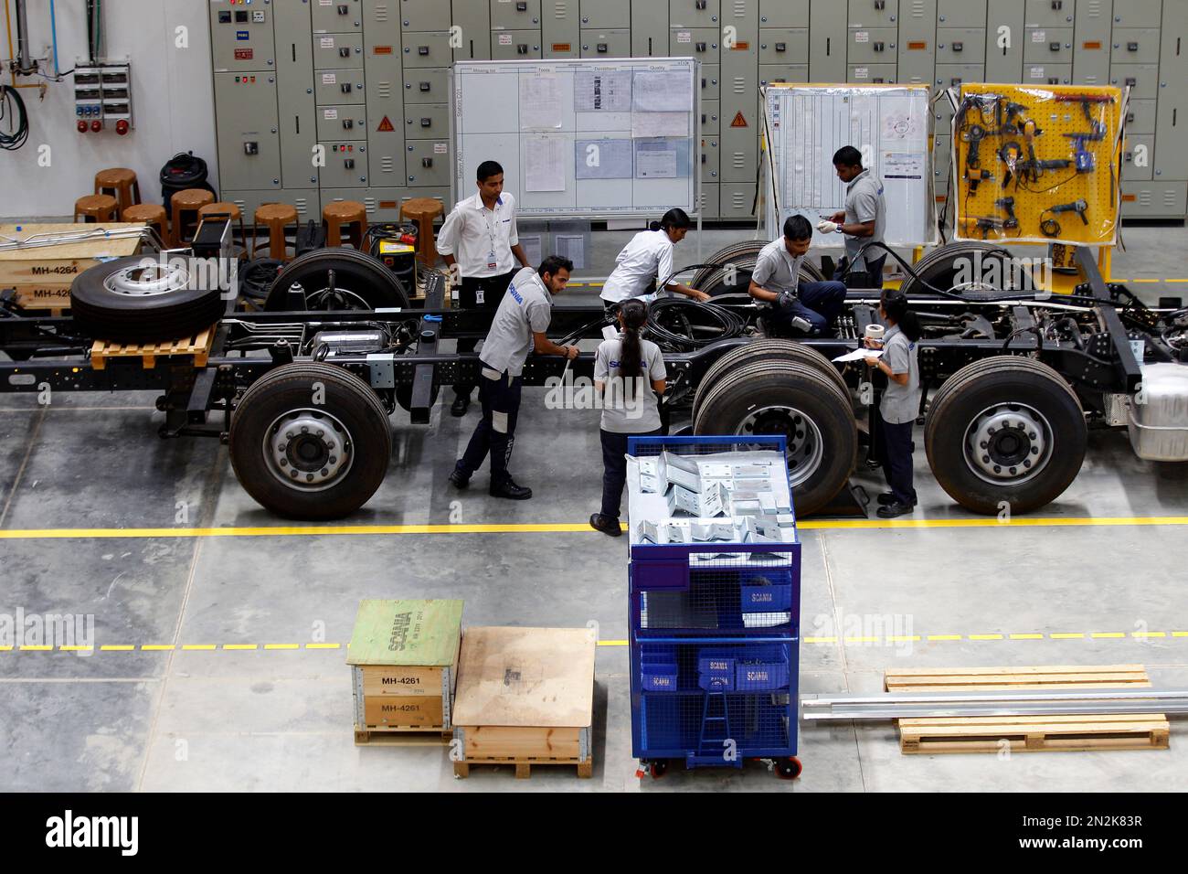Indian employees of Scania work at the company's new manufacturing ...