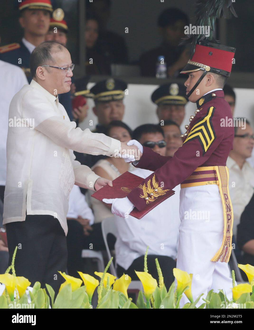 Philippine President Benigno Aquino III hands the diploma to Cadet ...