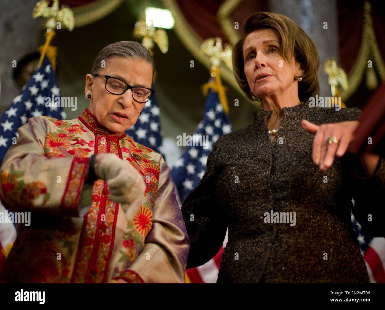 U.S. Supreme Court, Associate Justice Ruth Bader Ginsburg, left, checks ...