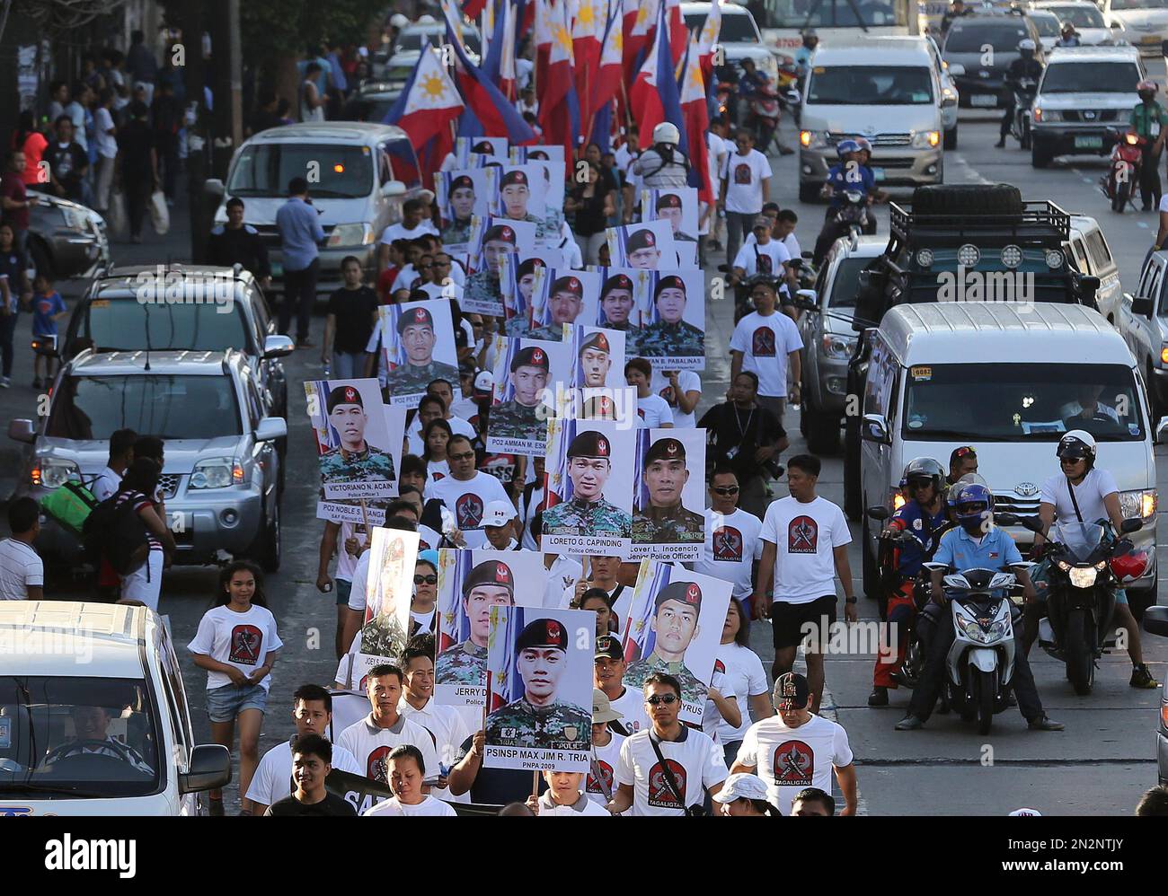 FILE - In this Sunday March 8, 2015, file photo, family and supporters ...