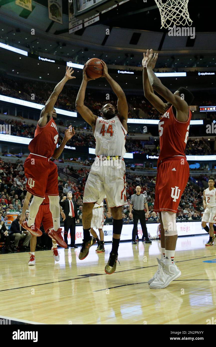 Maryland's Dez Wells (44) shoots between Indiana's Emmitt Holt (25 ...