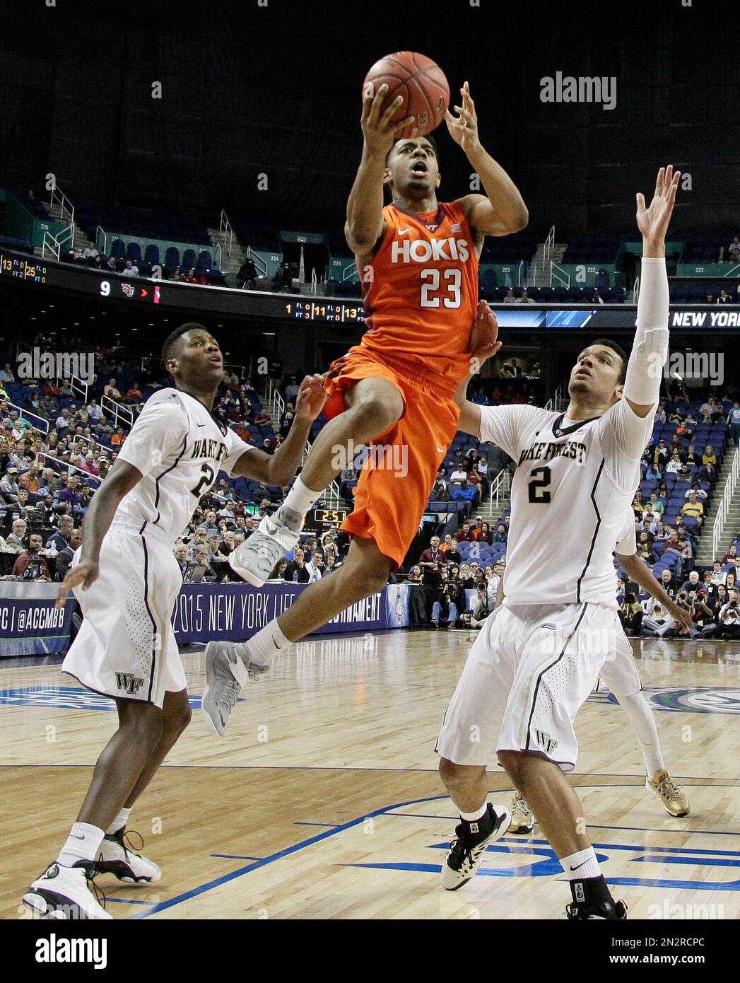 Virginia Tech's Jalen Hudson (23) drives between Wake Forest's Devin ...