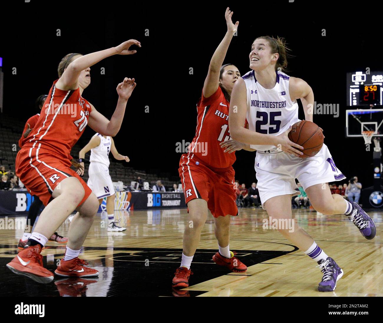 Northwestern guard Maggie Lyon (25) drives to the basket as Rutgers ...