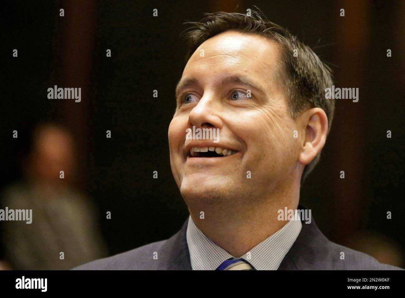 Illinois Rep. Tim Butler, R-Springfield, reacts to applause after ...