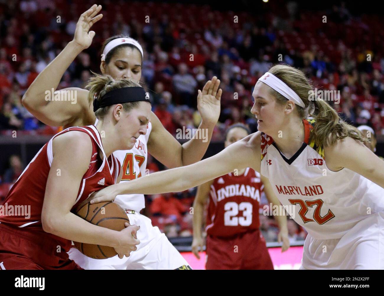 Indiana forward Amanda Cahill, left, tries to protect the ball as she ...