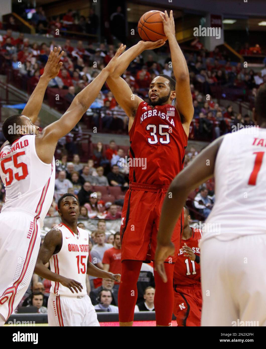 Nebraska's Walter Pitchford (35) goes up for a shot between Ohio State ...