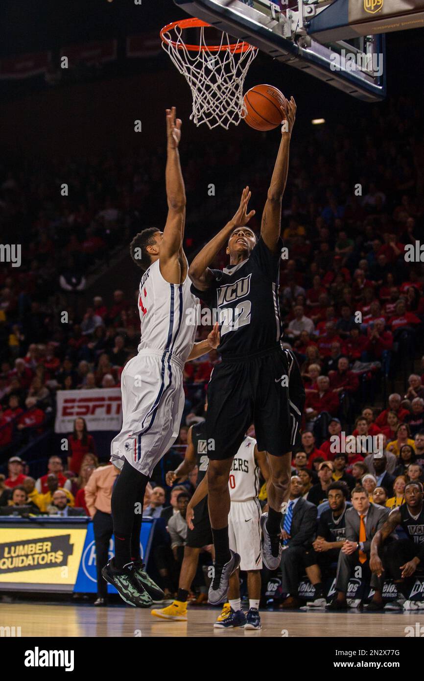 VCU guard Terry Larrier, right, takes a shot as Richmond forward Deion ...
