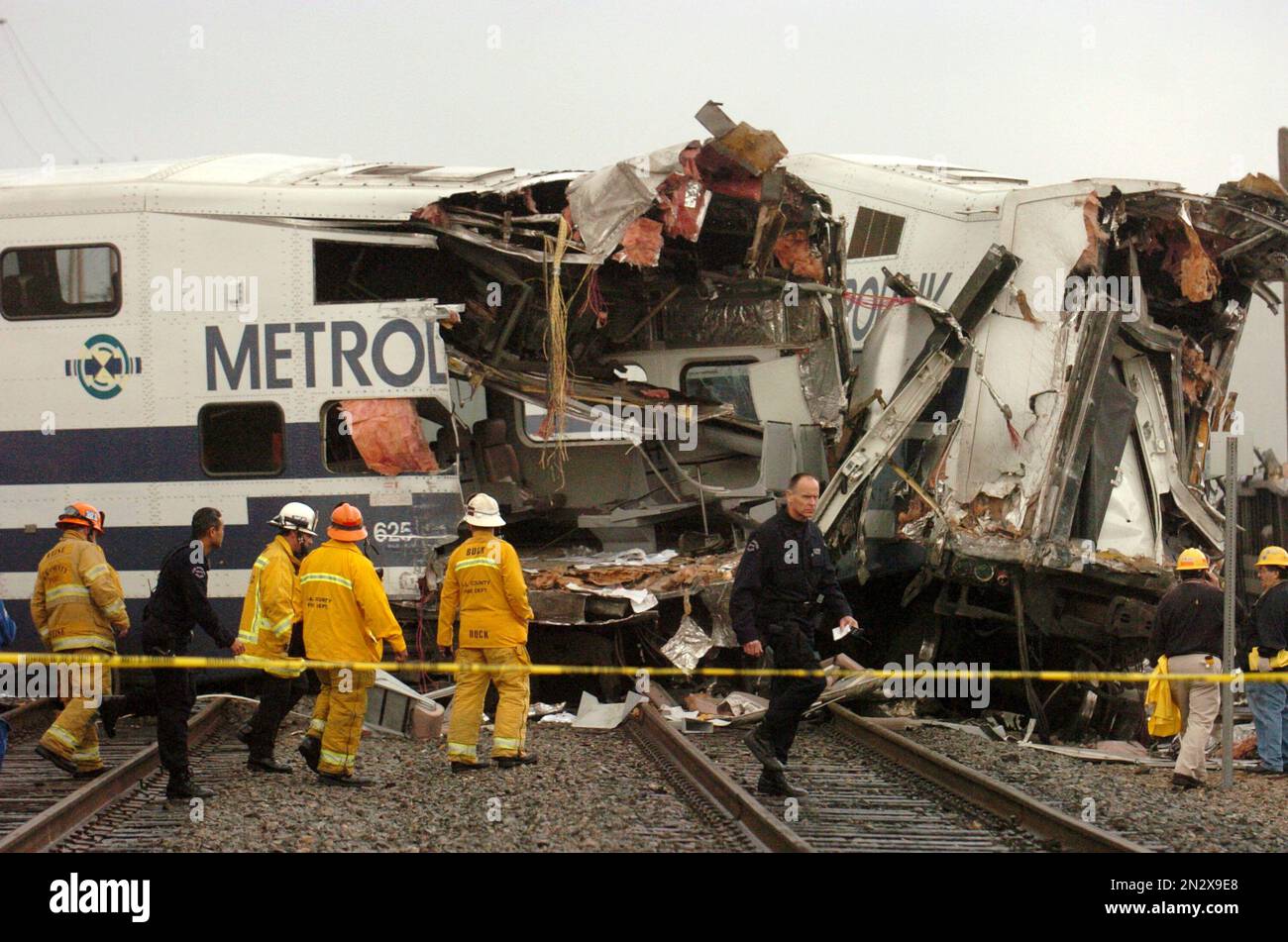 FILE - In this Jan. 26, 2005 file photo emergency workers stand near ...