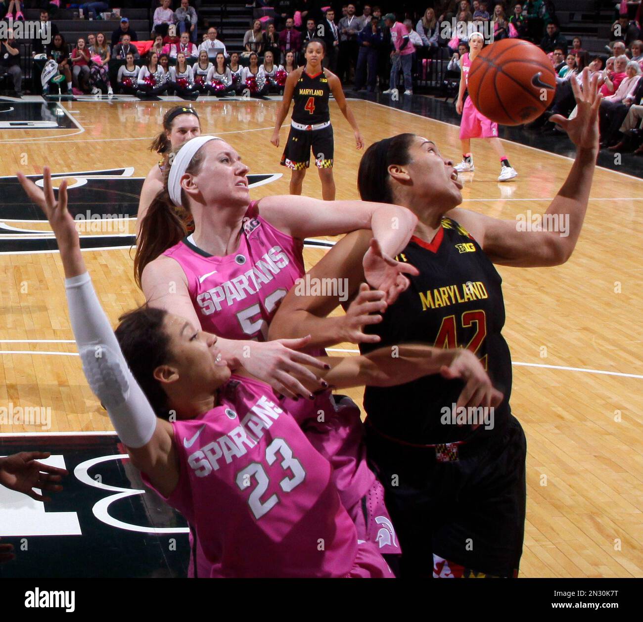 Michigan State's Aerial Powers (23) and Becca Mills, center, and ...