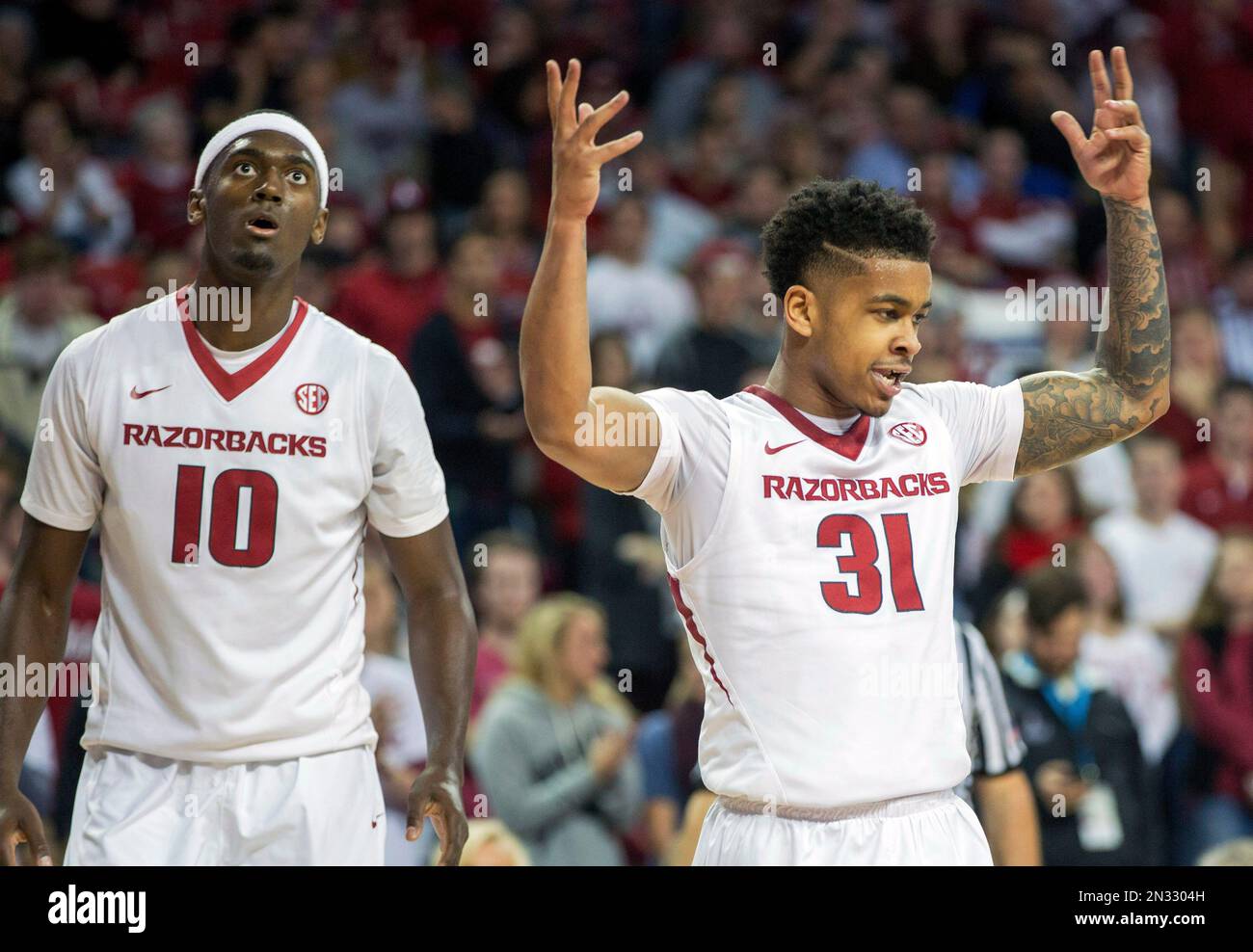 Arkansas guard Anton Beard, right, celebrates after a defensive stop ...