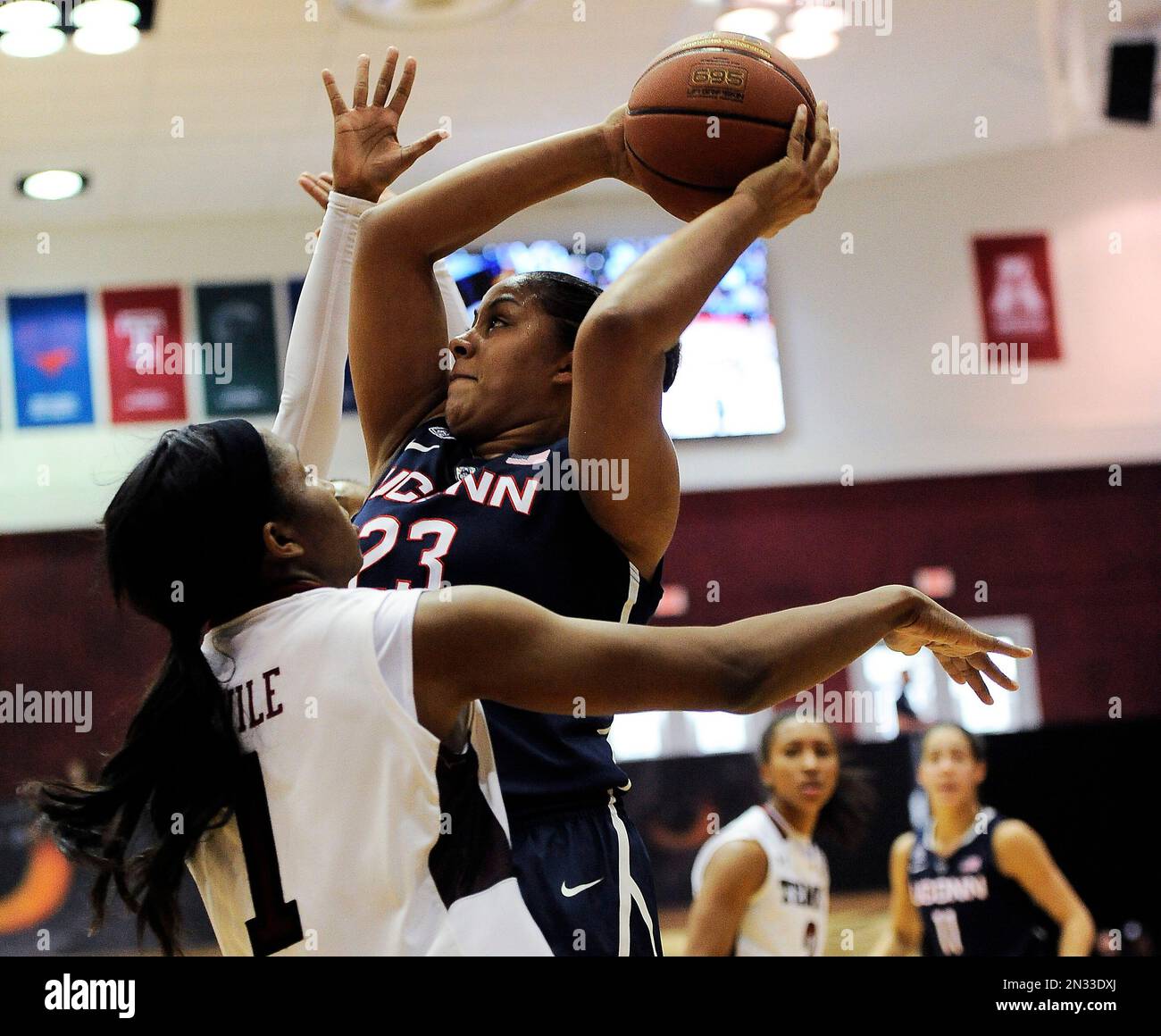 Connecticut's Kaleena Mosqueda-Lewis (23) looks for room to shoot over ...