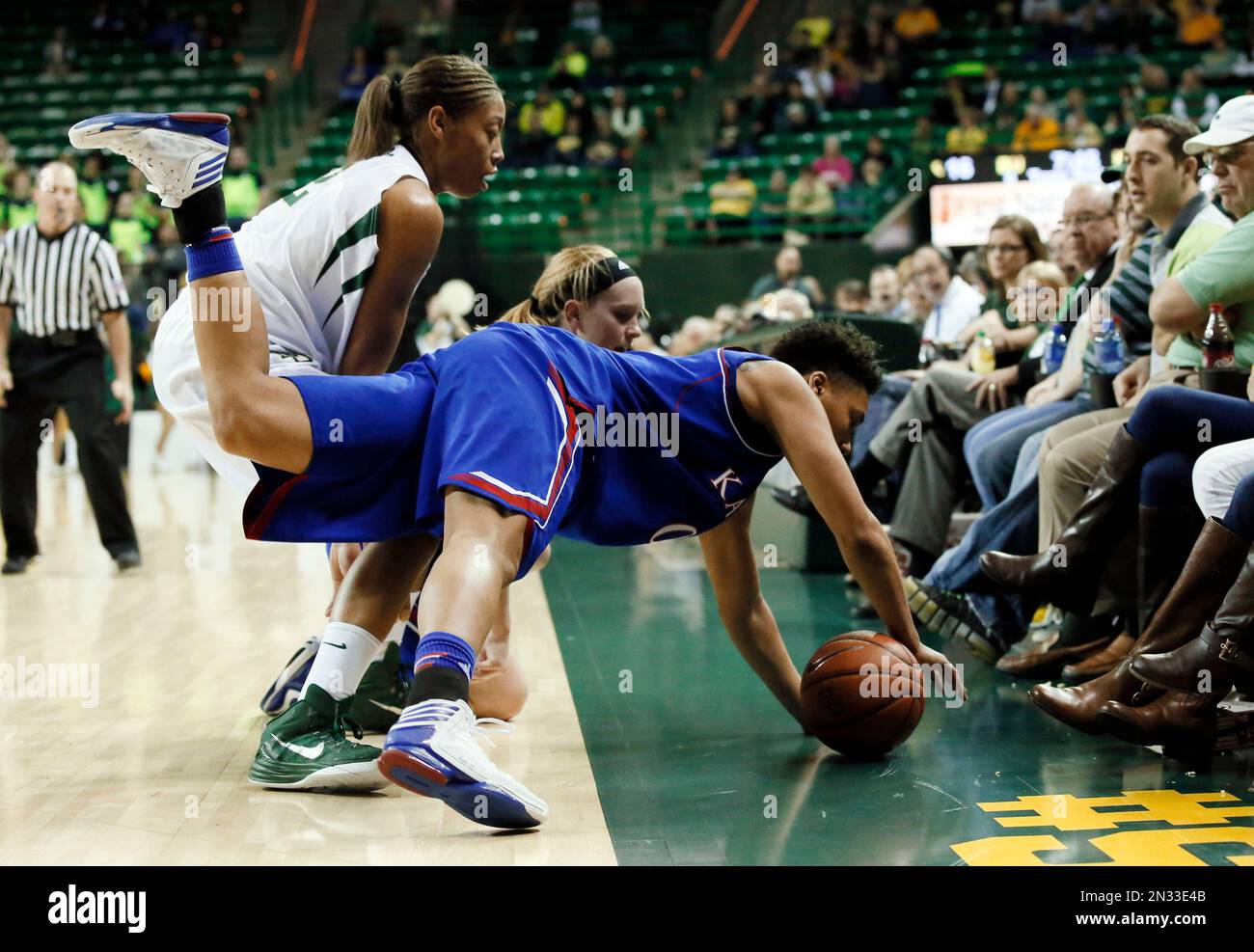 Baylor guard Alexis Prince, top left, and Kansas' Lauren Aldridge, rear ...