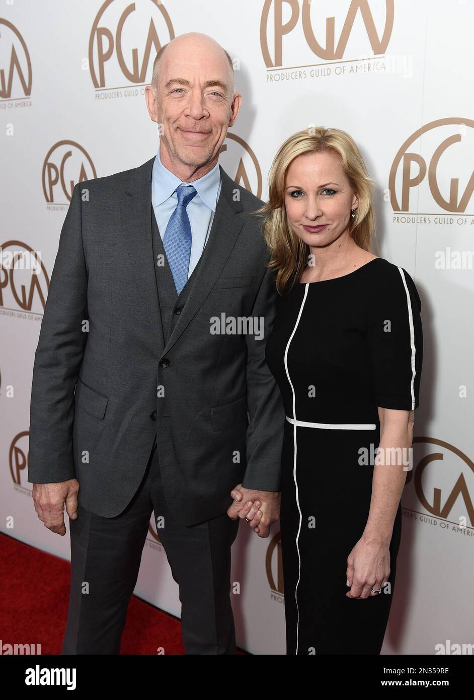 J.K. Simmons, left, and Michelle Schumacher arrive at the 26th Annual ...