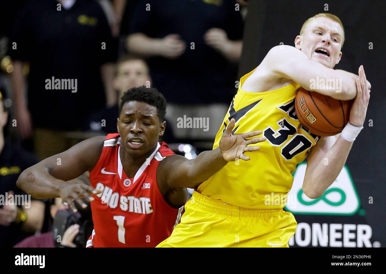 Iowa forward Aaron White, right, grabs a rebound in front of Ohio State ...