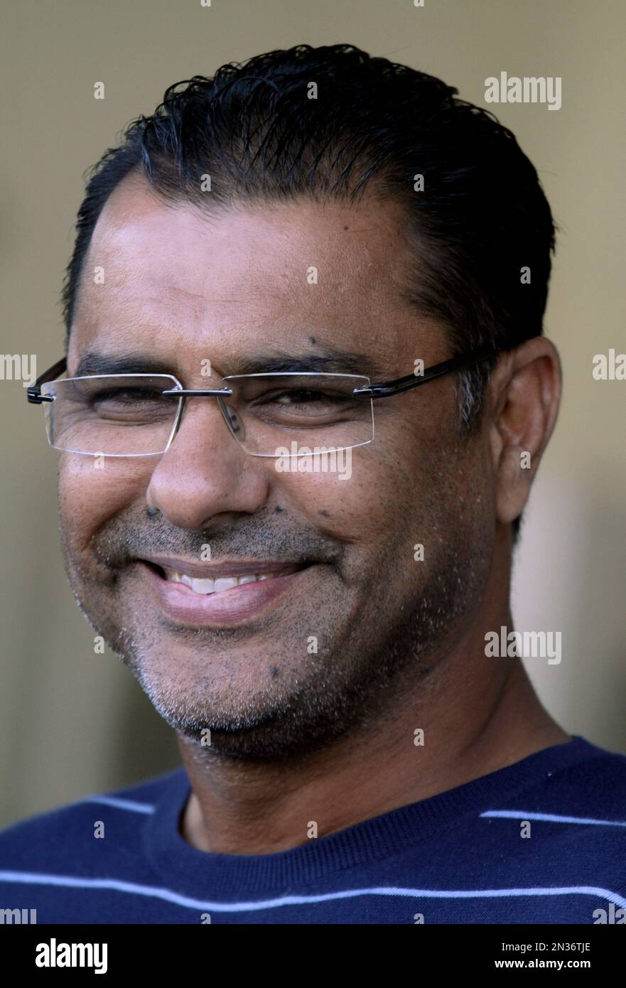 Head coach of the Pakistani cricket team Waqar Younis smiles as he ...