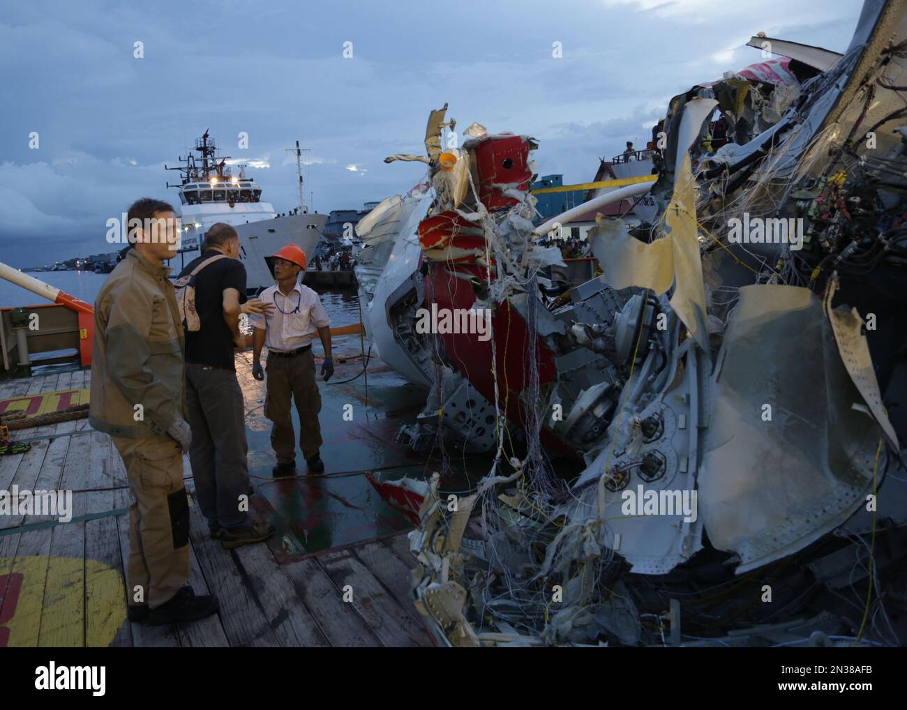 An Indonesian member of National Transportation Safety Board talk with ...