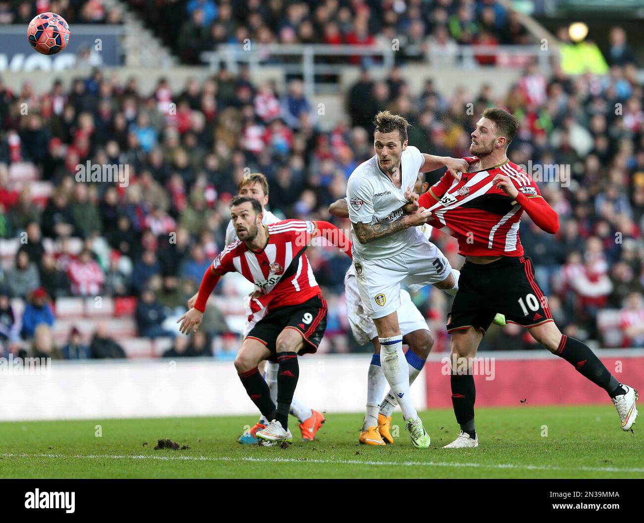 Sunderland's Connor Wickham, right, vies for the ball with Leeds United ...