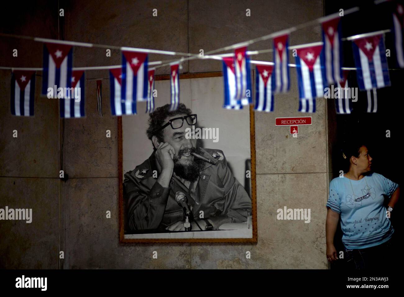 A photograph Fidel Castro hangs in a municipal building where miniature ...