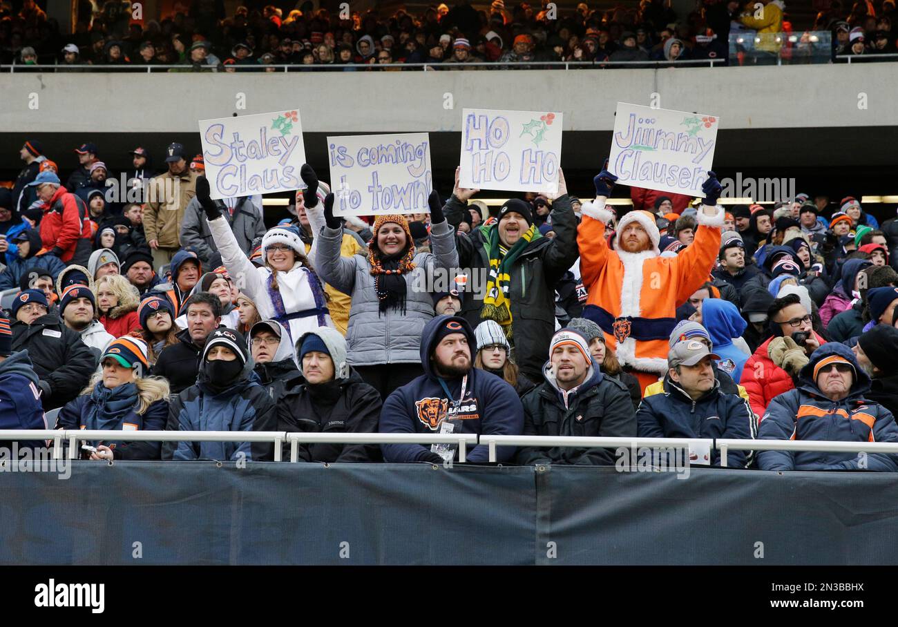 Fans at Soldier Field hold up signs in the first half of an NFL ...