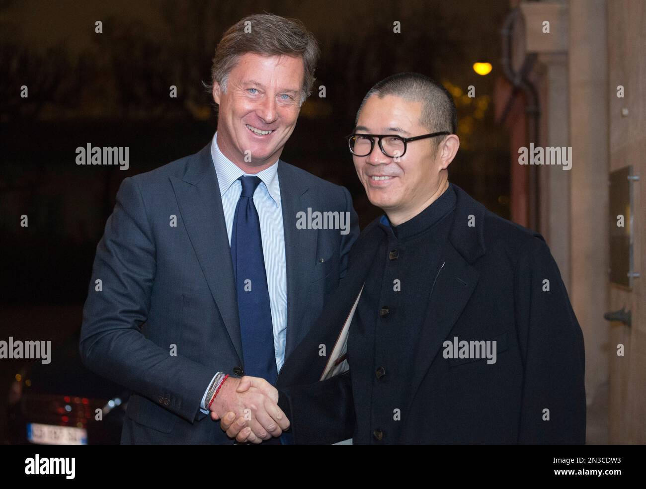 Sebastien Bazin, left, CEO of Accor hotel group, shakes hands with Ji ...