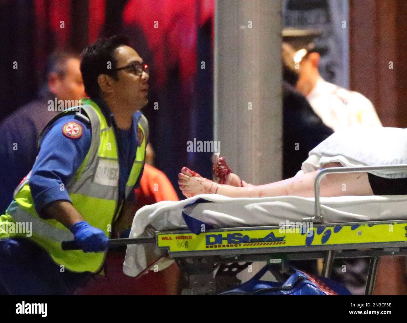 A injured hostage is wheeled to an ambulance after shots were fired ...