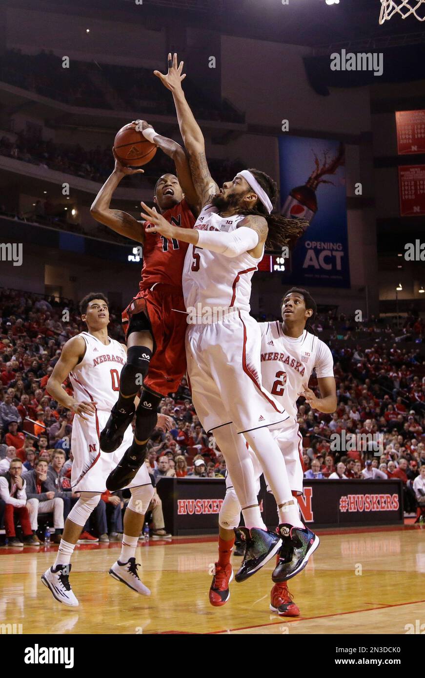 Incarnate Word's Denzel Livingston (11) is fouled by Nebraska's Terran ...