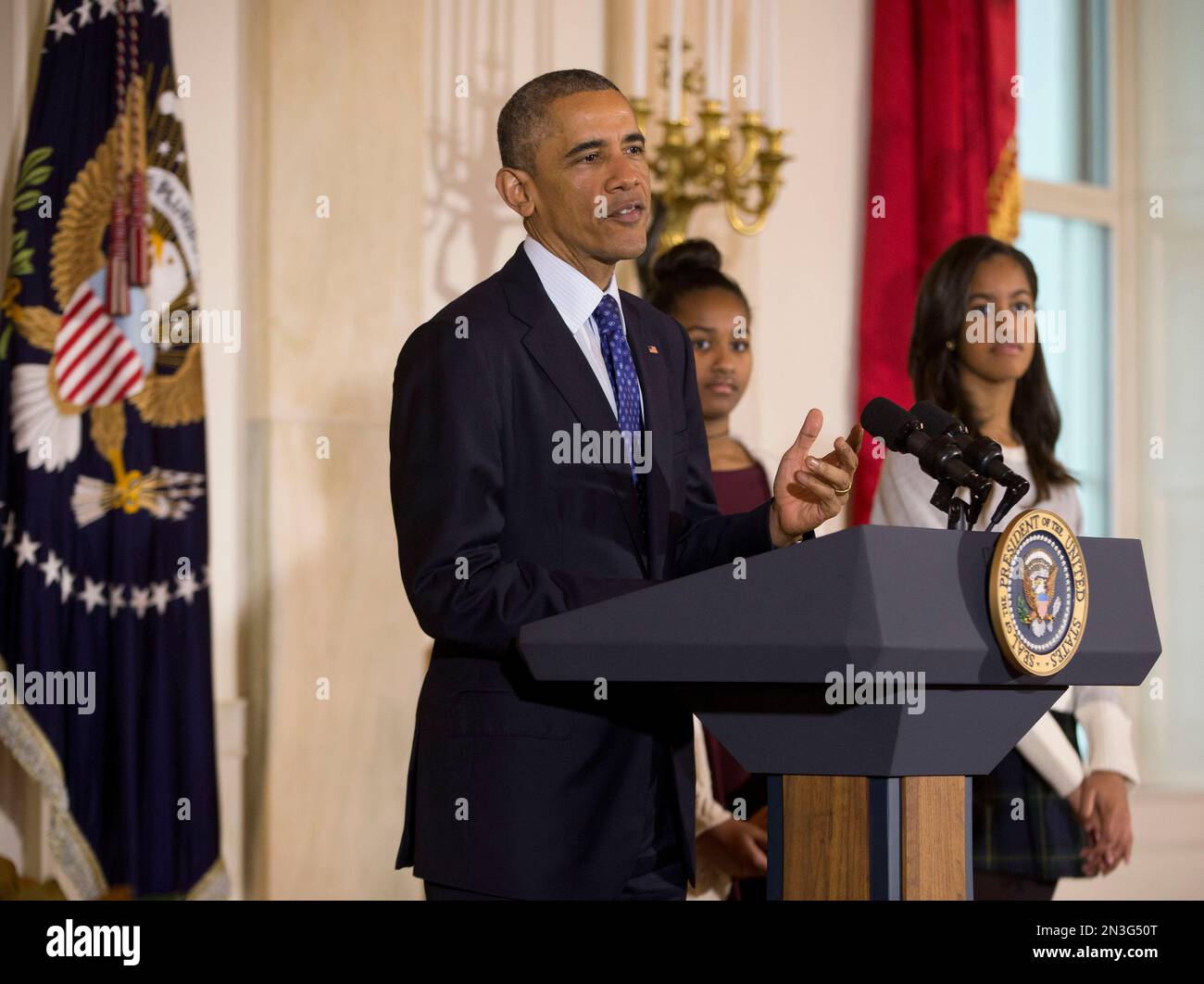 President Barack Obama, joined by his daughters Sasha, center, and ...