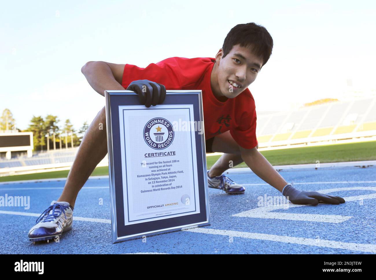 Katsumi Tamakoshi poses with the Certificate of the Guinness World ...