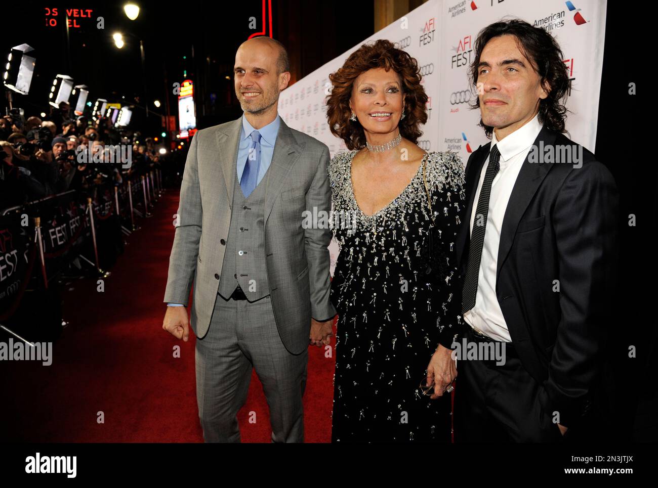Italian actress Sophia Loren, center, poses with her sons Edoardo Ponti ...