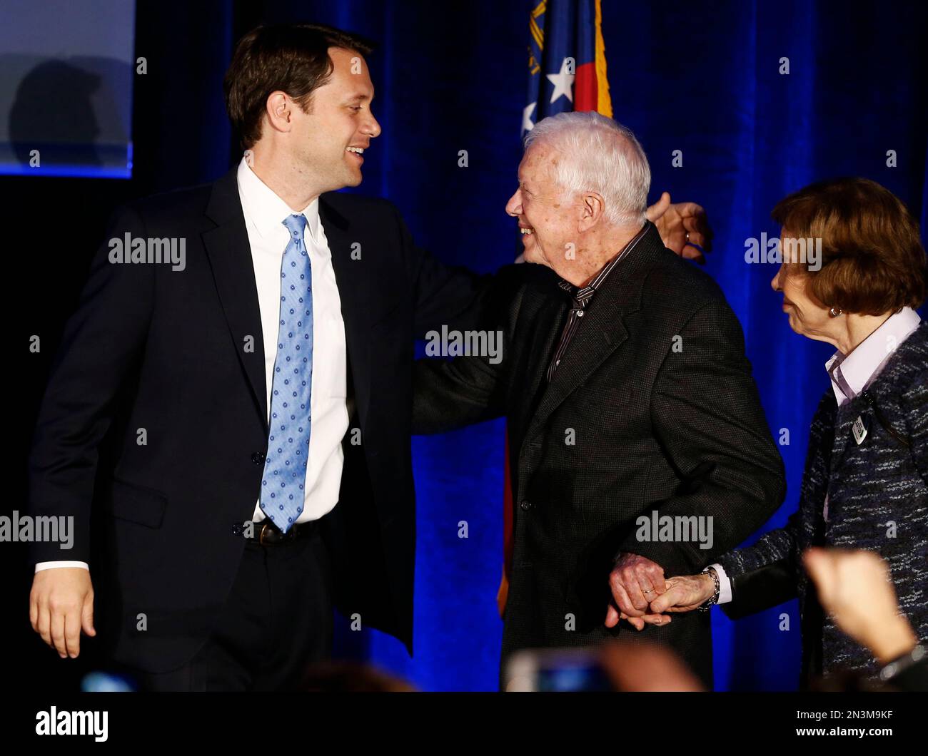 Democratic gubernatorial candidate Jason Carter, left, embraces his ...