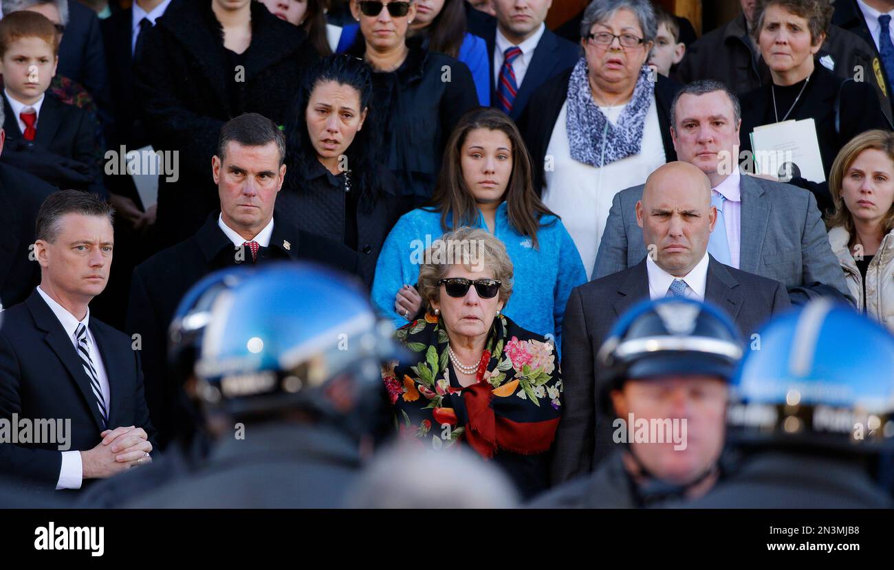 Angela Menino, center, stands behind her husband's casket, former ...