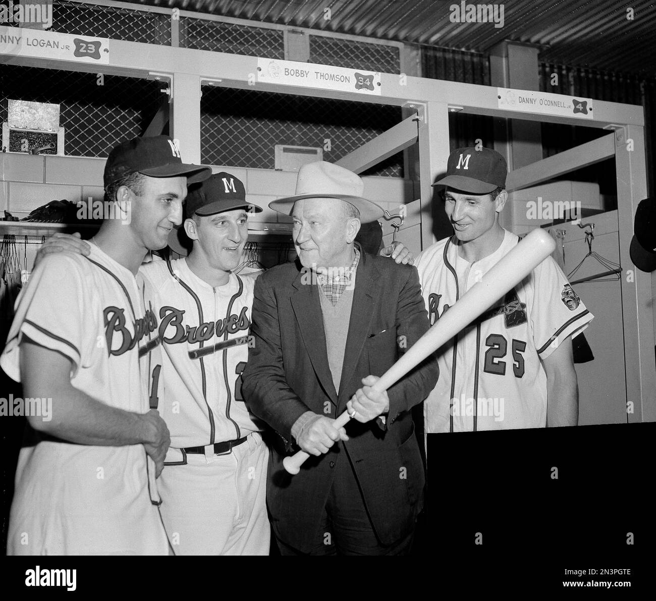 Ty Cobb, one of baseball's all-time greats, has a glint in his eye as ...