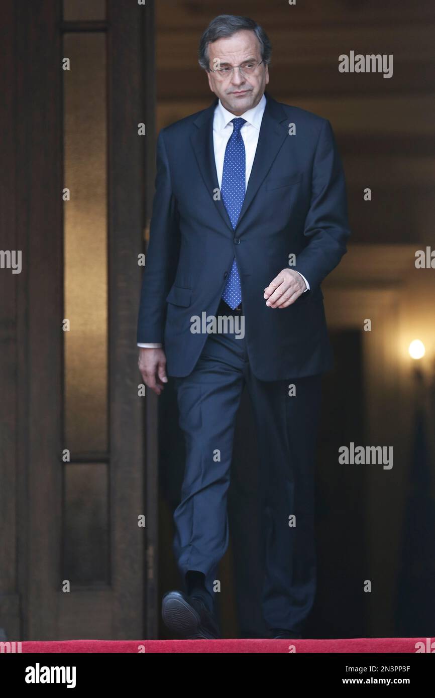 Greek Prime Minister Antonis Samaras, walks out his office to welcome ...