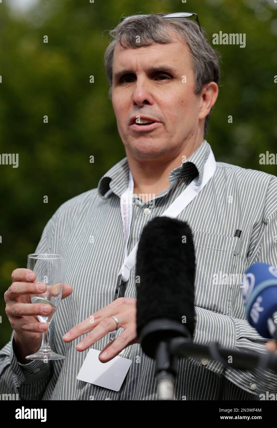 Eric Betzig from the U.S. talks to journalists in front of the ...