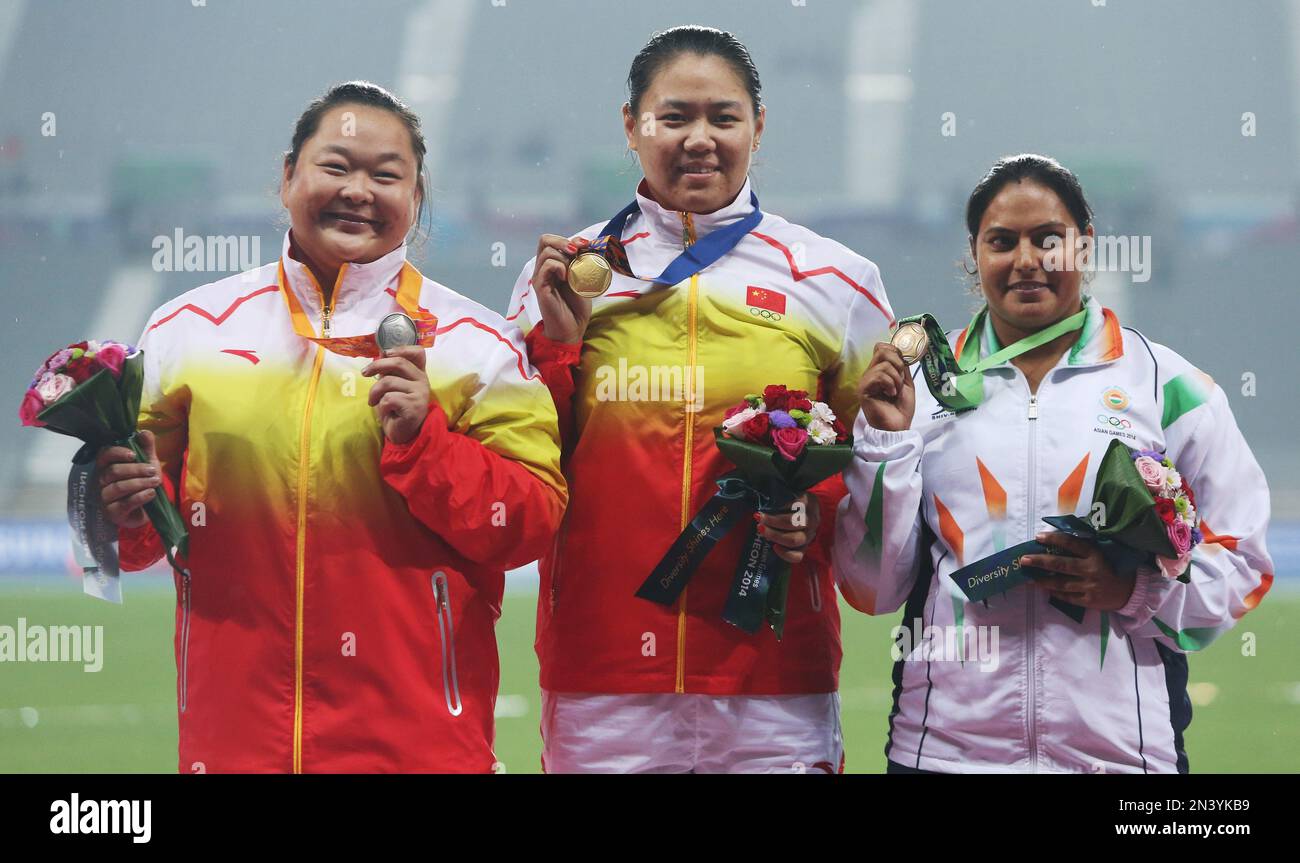 From left, silver medalist China’s Wang Zheng, gold medalist Zhang ...
