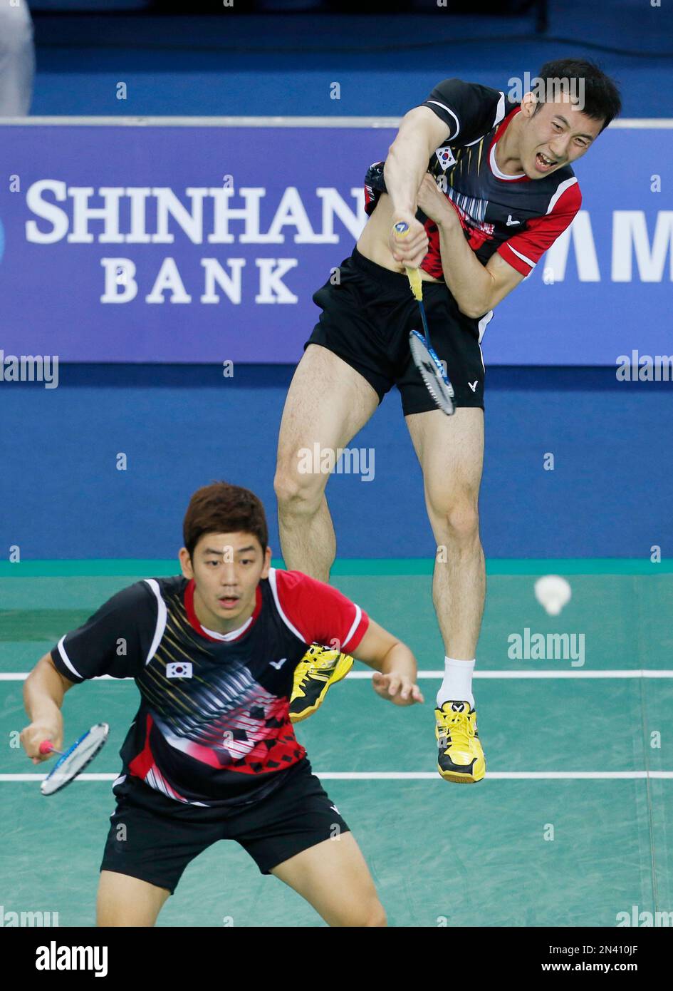 South Korea’s Yoo Yeon-seong, top, and Lee Yong-dae return a shot to ...