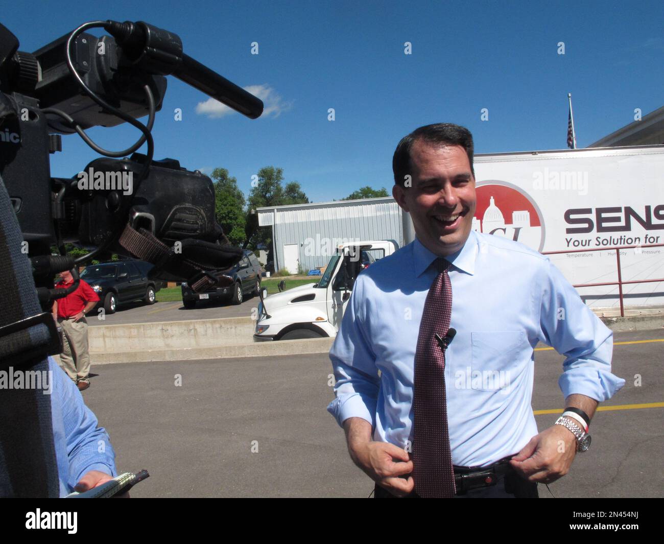 Wisconsin Gov. Scott Walker laughs before taking questions on Wednesday, Sept. 3, 2014, in ...