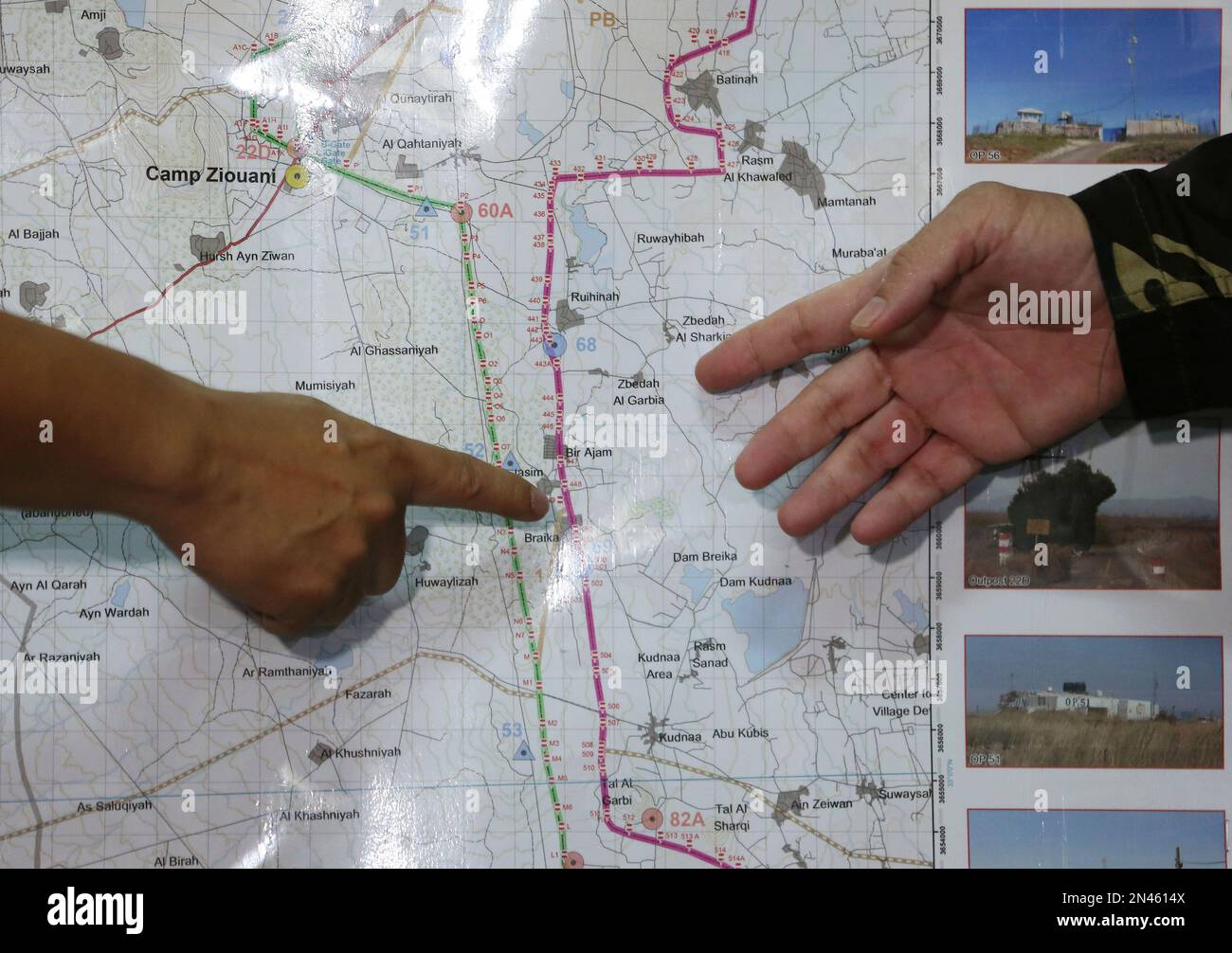 Philippine Military Spokesman Maj. Gen. Domingo Tutaan, left, points to ...