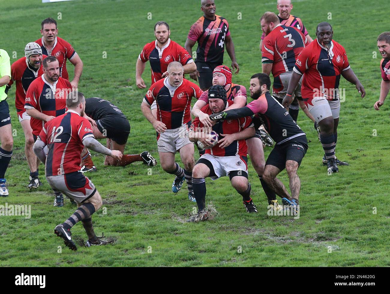 Boston Ironside rugby team player, center, is tackled by Amsterdam ...