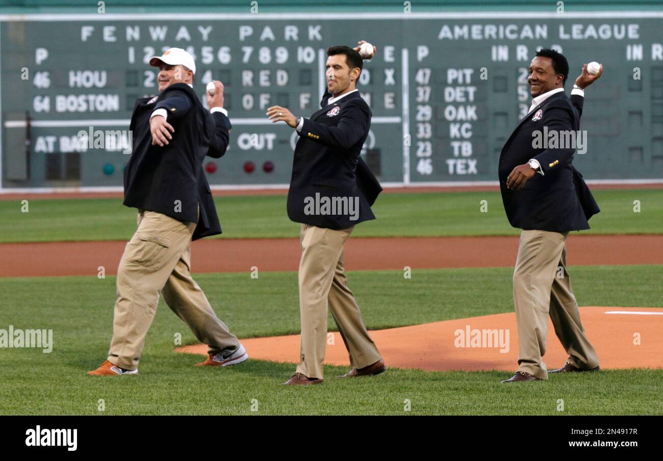 Boston Red Sox greats Roger Clemens, Nomar Garciaparra and Pedro Martinez throw out the ...
