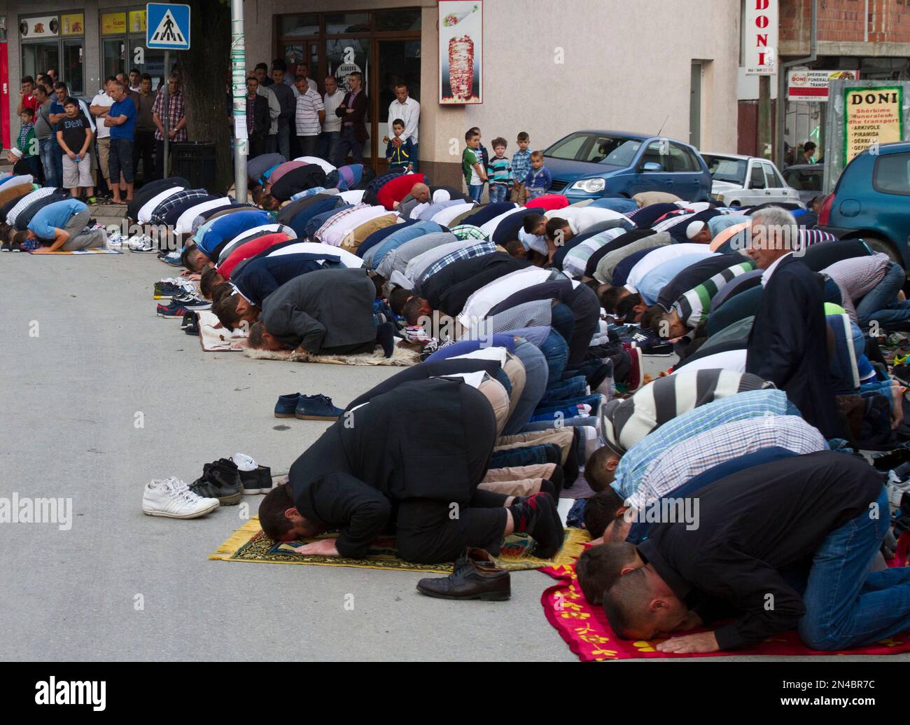 Kosovo Muslims offer Eid al-Fitr prayers outsidethe Sultan Mehmet Fatih grand mosque during the ...