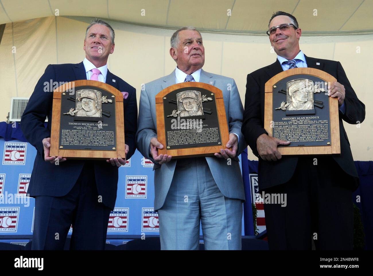 National Baseball Hall of Fame inductees Tom Glavine, left, Bobby Cox, center, and Greg Maddux ...