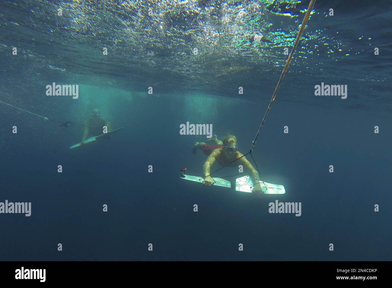 Simon Silvertsen, right, and his cousin Mats Westgard dive using a ...