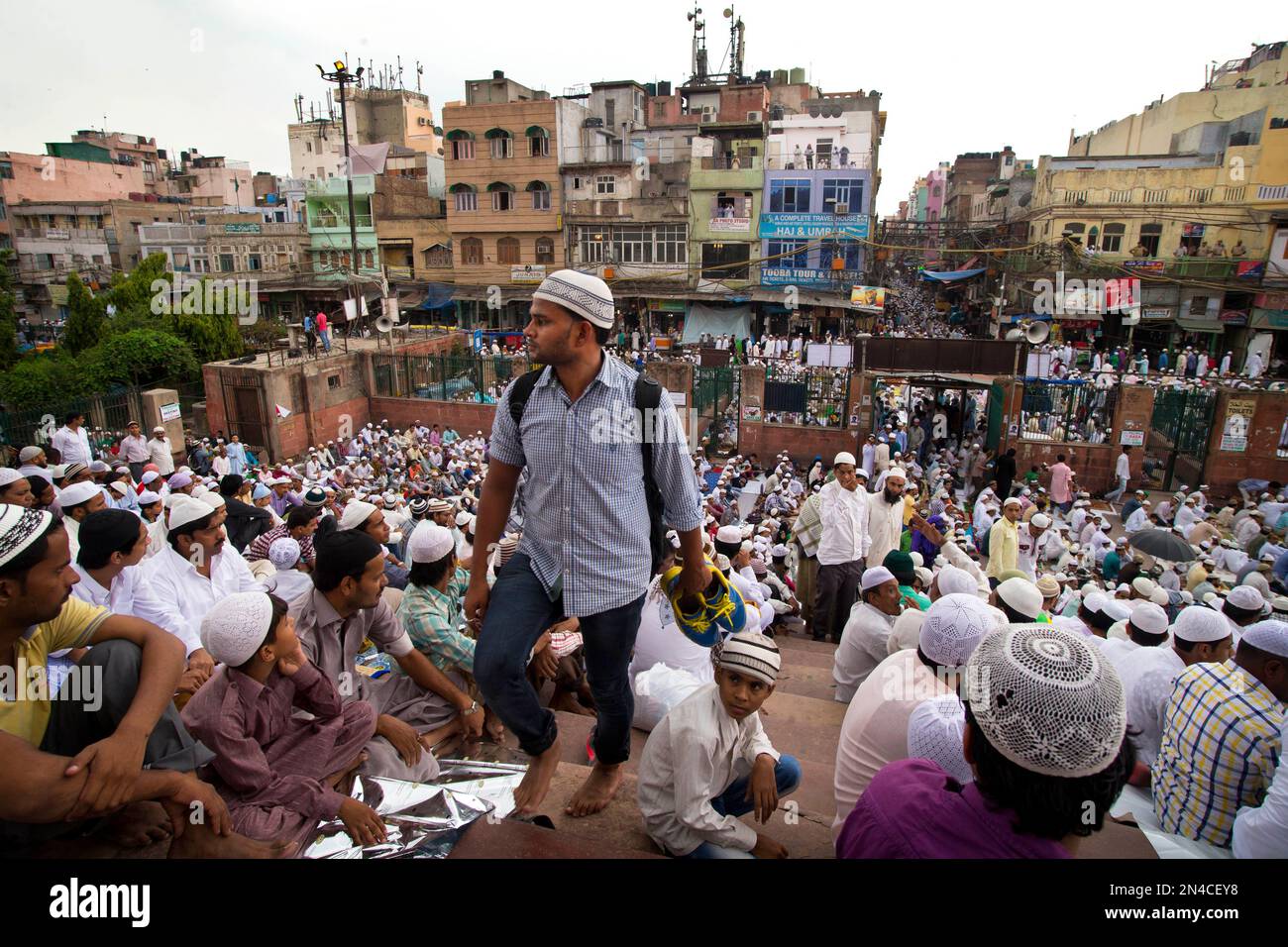 An Indian Muslim looks for space to settle for prayers, on the last ...