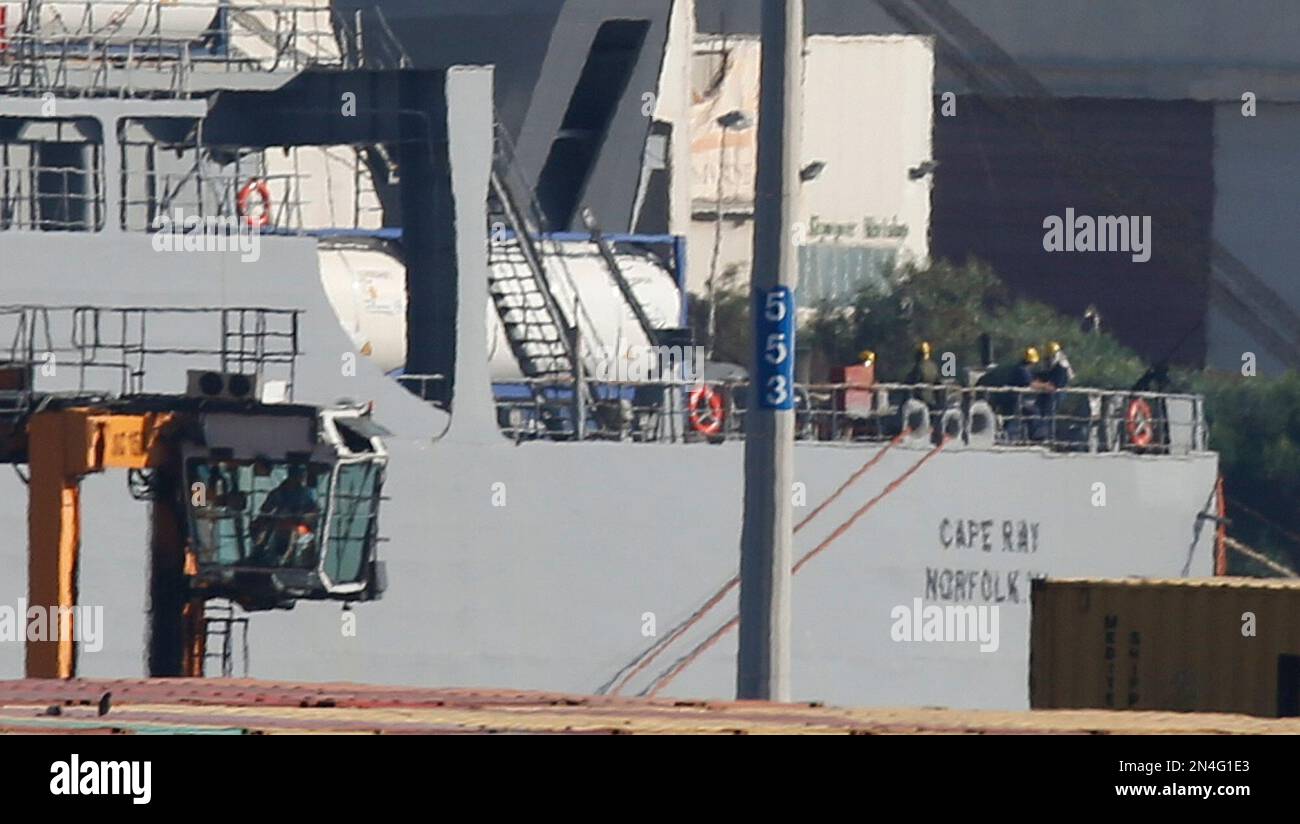 People are seen on board the MV Cape Ray as it docked at Gioia Tauro ...