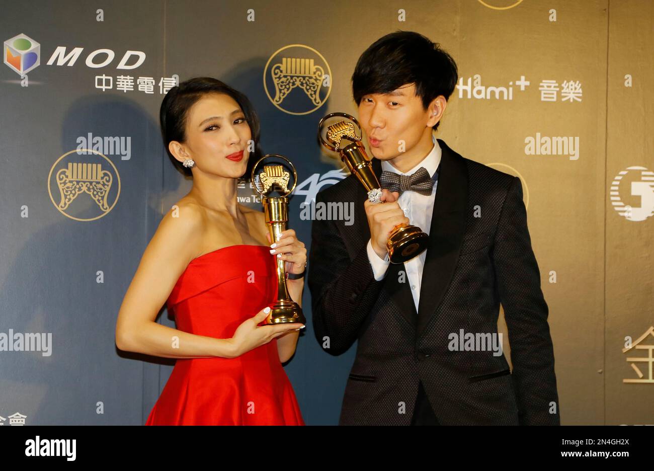 Malaysian singer Penny Tai, left, and Singapore singer JJ Lin kiss ...